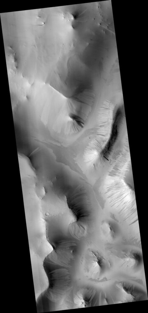 Caught on Camera: Bright and Dark Slope Streaks on Mars